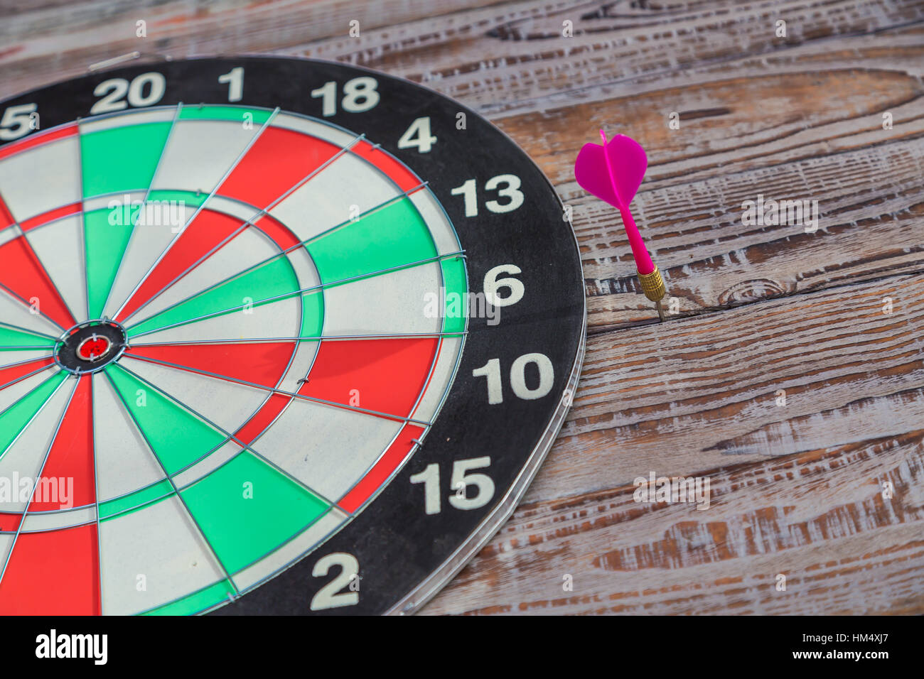 Dartboard on wood wall (miss darts Stock Photo - Alamy