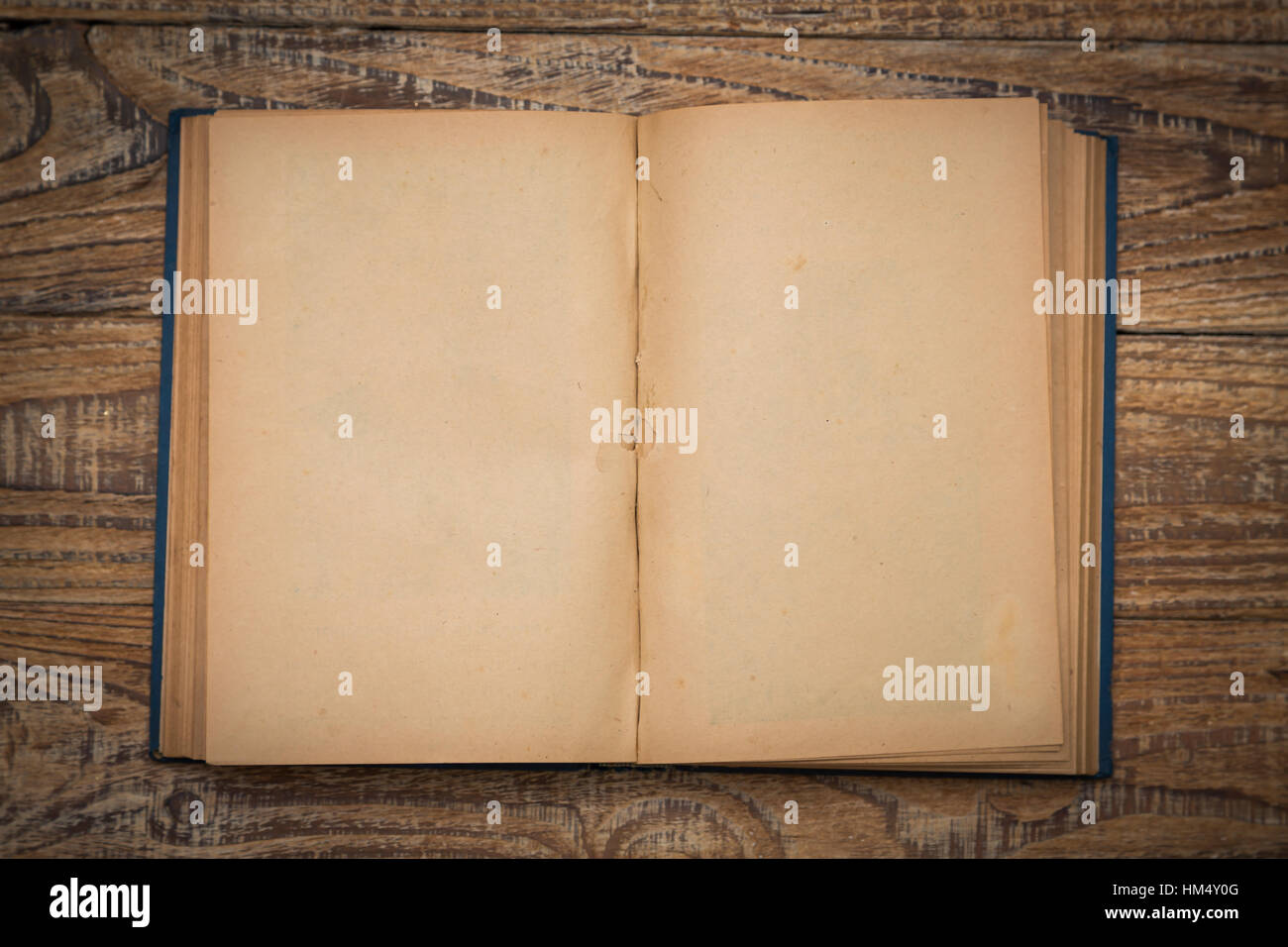 Open blank pages of old book on wood background Stock Photo - Alamy