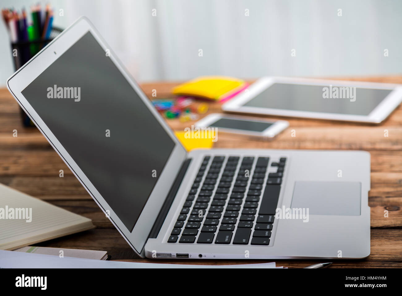 laptop computer on wood table Stock Photo - Alamy