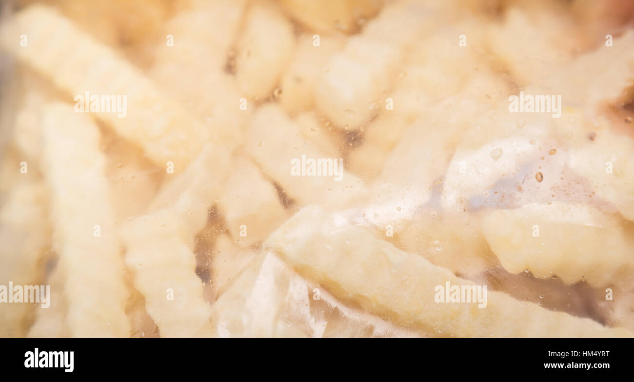 French fries package on wood background Stock Photo - Alamy