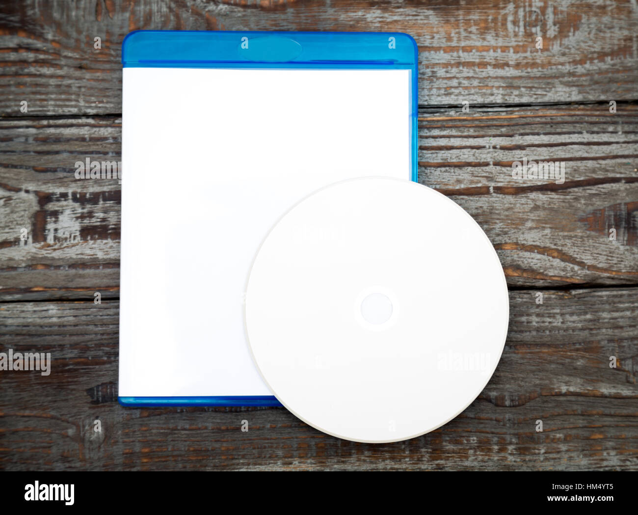 Blank compact disc with cover on wood background ground Stock Photo - Alamy