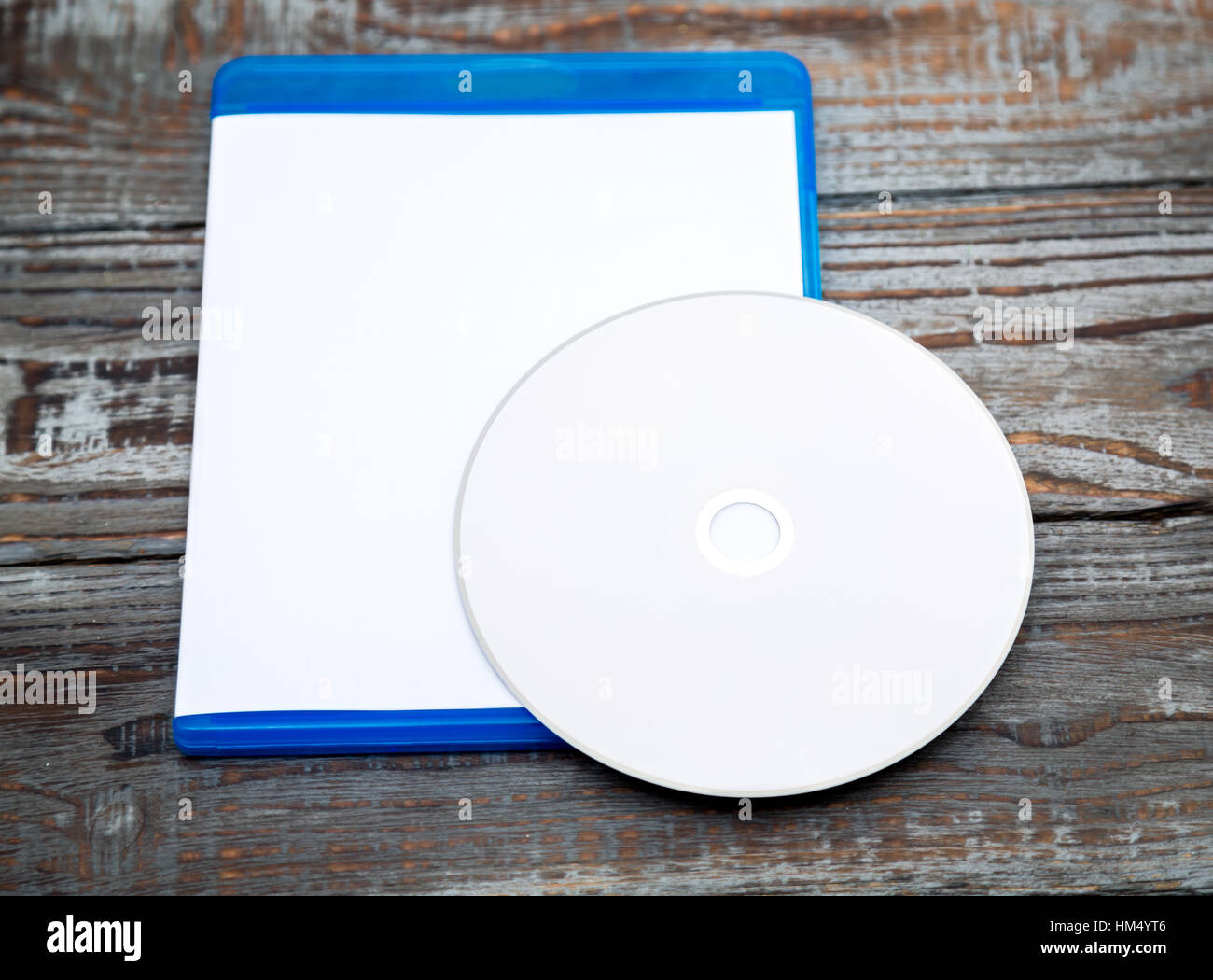 Blank compact disc with cover on wood background ground Stock Photo - Alamy