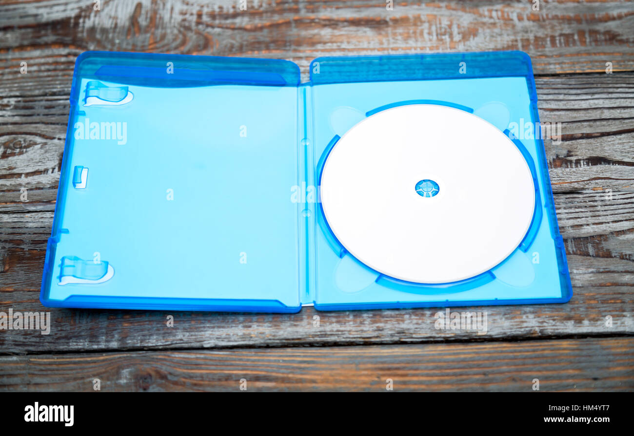 Blank compact disc with cover on wood background ground Stock Photo - Alamy