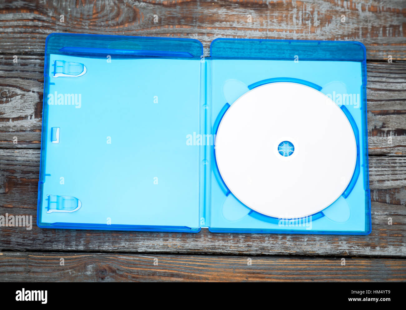 Blank compact disc with cover on wood background ground Stock Photo - Alamy