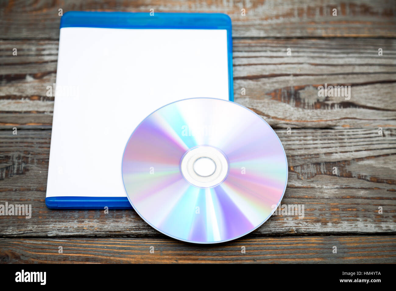 Blank compact disc with cover on wood background ground Stock Photo - Alamy