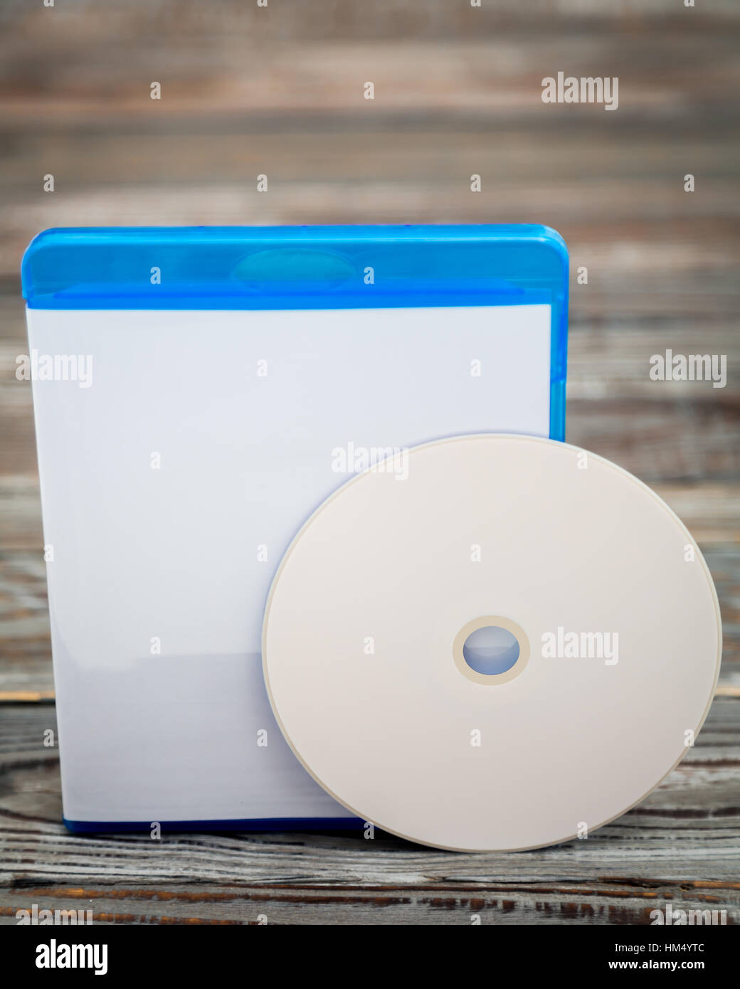 Blank compact disc with cover on wood background ground Stock Photo - Alamy