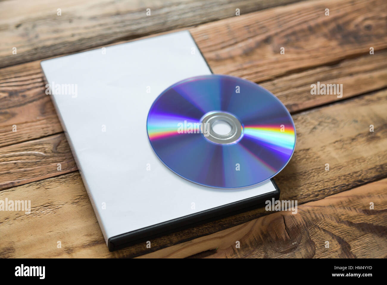 Blank compact disc with cover on wood background ground Stock Photo - Alamy