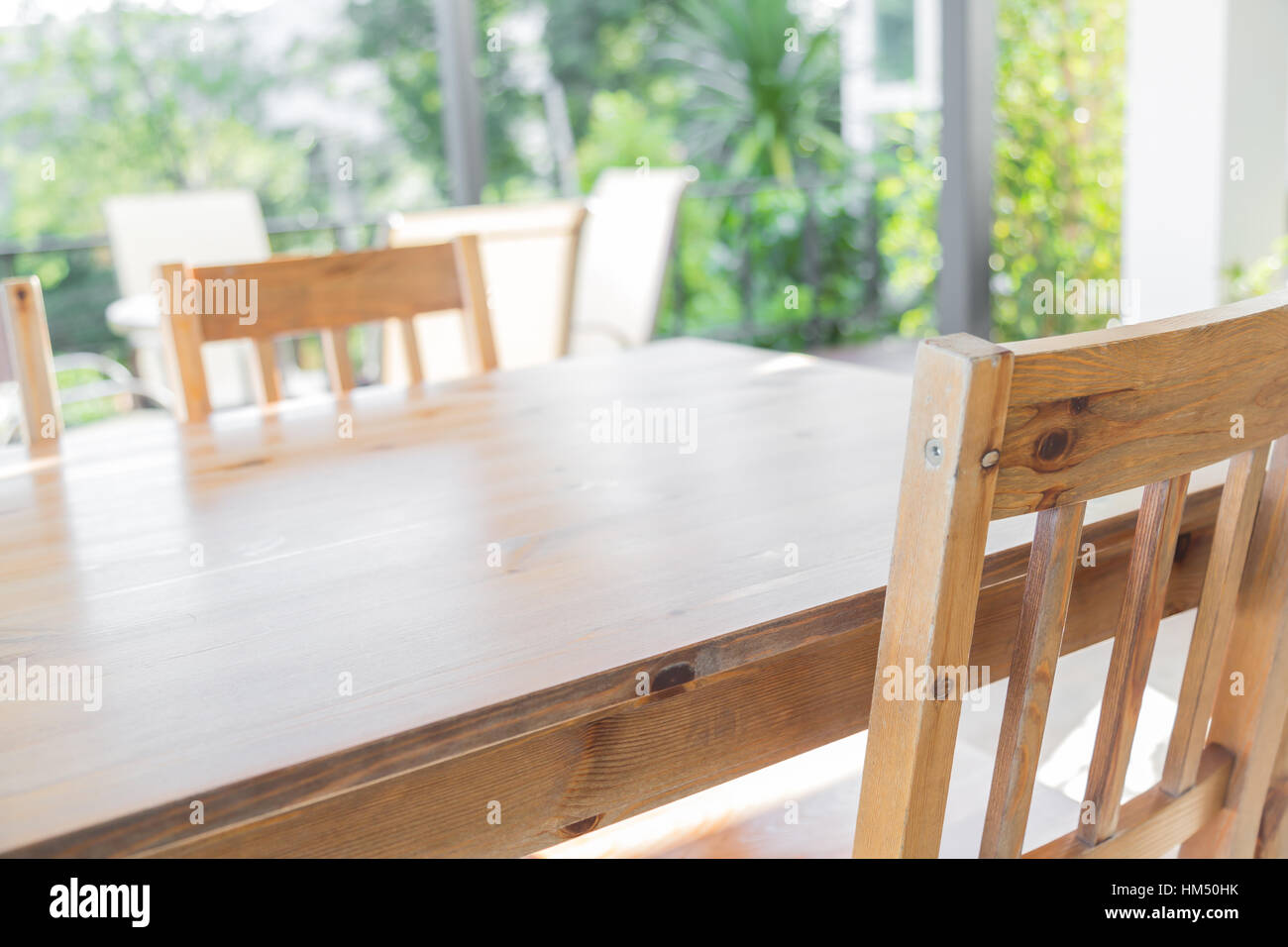 Wood table at restaurant Stock Photo - Alamy