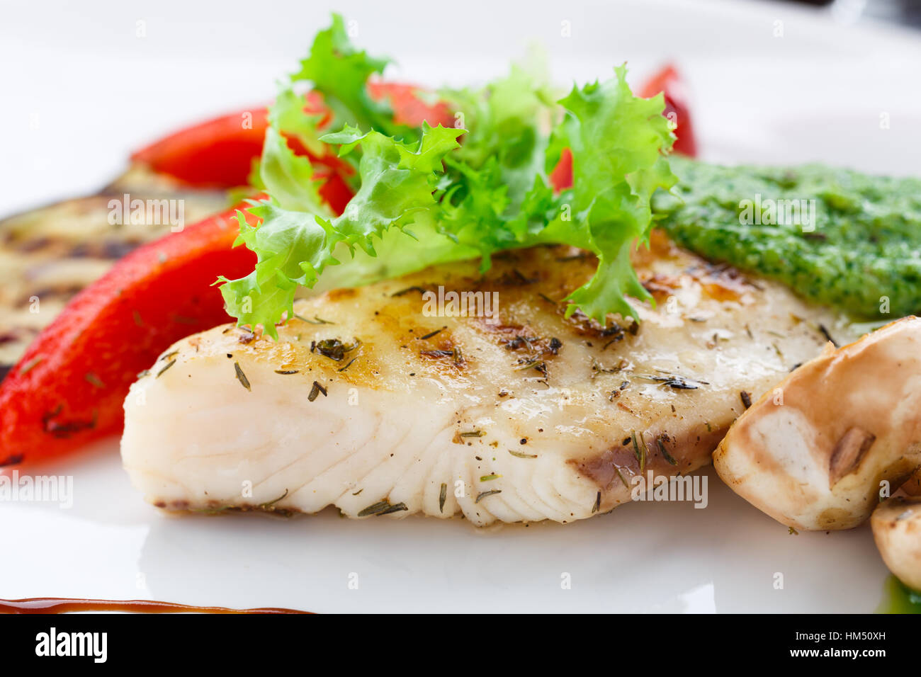 Grilled fish fillet with vegetables Stock Photo - Alamy