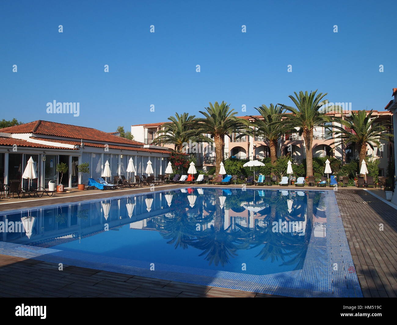 Reflection in a pool, azure blue water, hotel yard, Zakynthos island ...