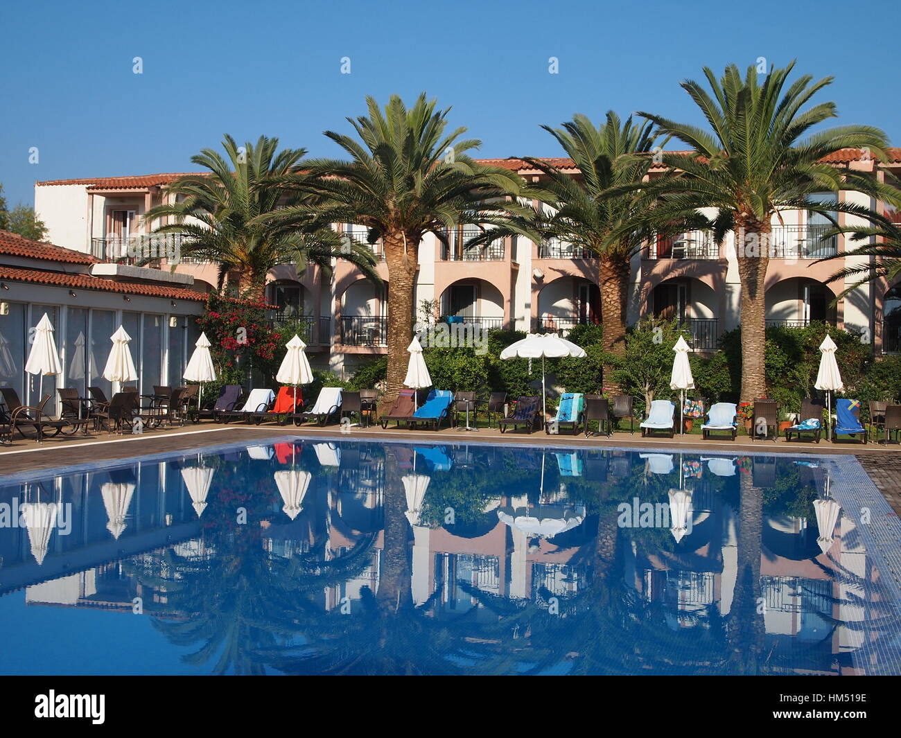Reflection in a pool, azure blue water, hotel yard, Zakynthos island ...