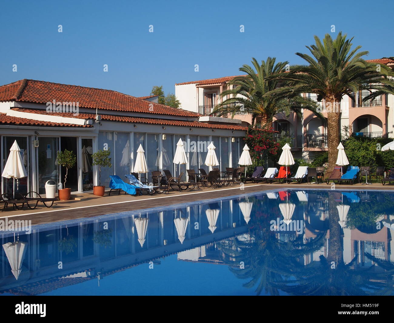 Reflection in a pool, azure blue water, hotel yard, Zakynthos island ...
