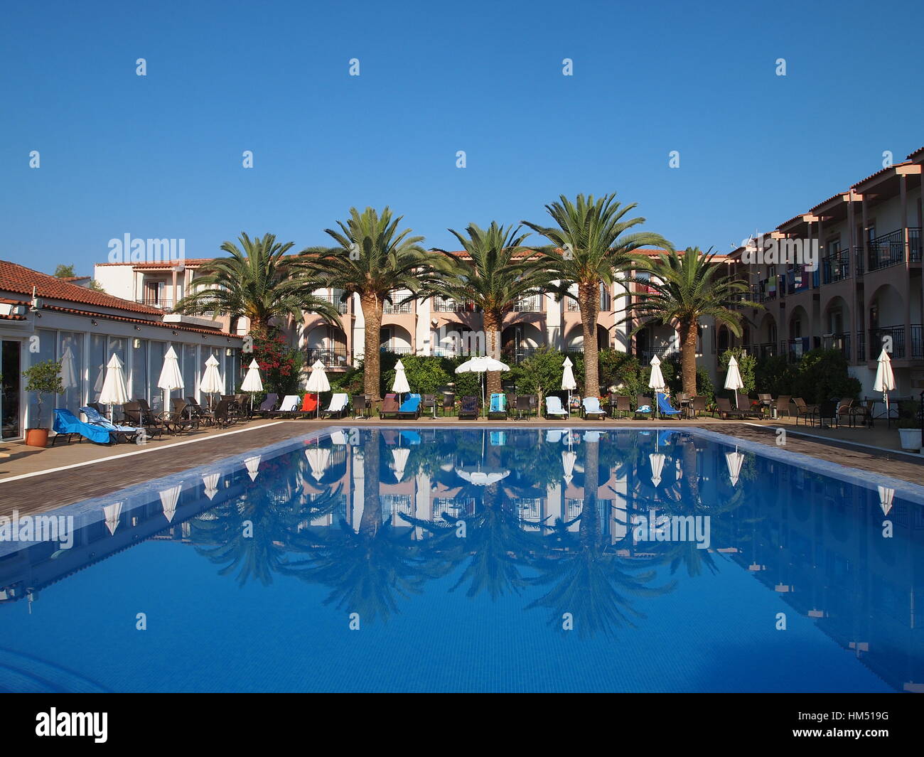 Reflection in a pool, azure blue water, hotel yard, Zakynthos island ...