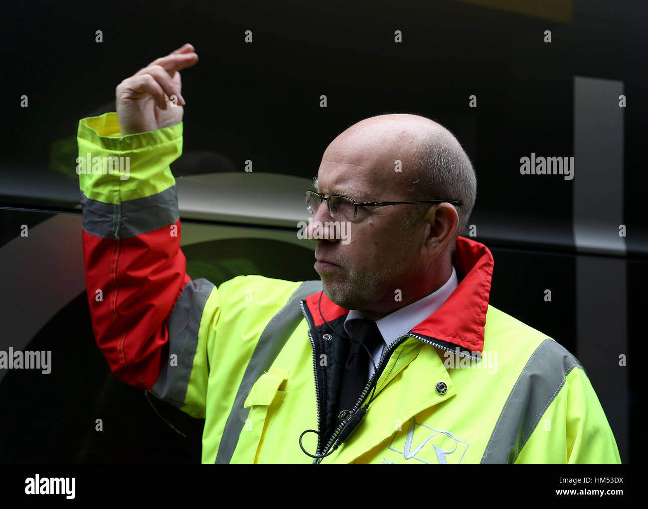 A steward gestures Stock Photo - Alamy