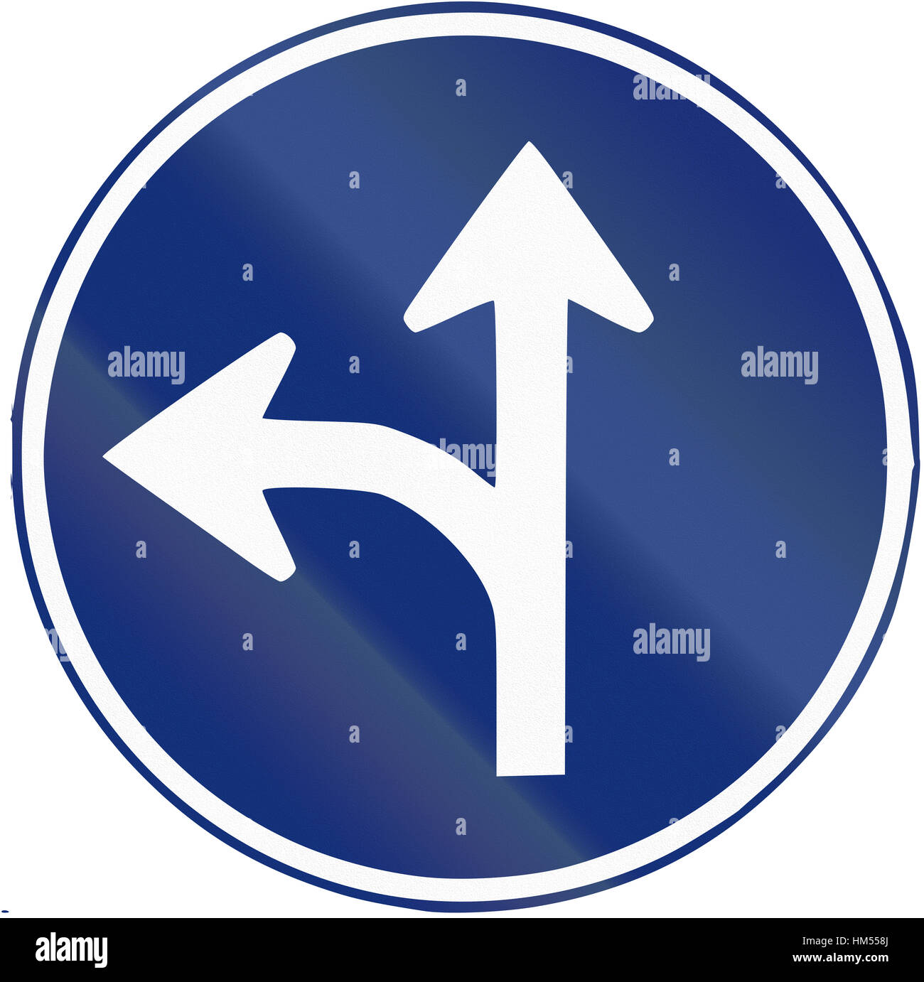 Road sign used in Spain - turn left or straight Stock Photo - Alamy