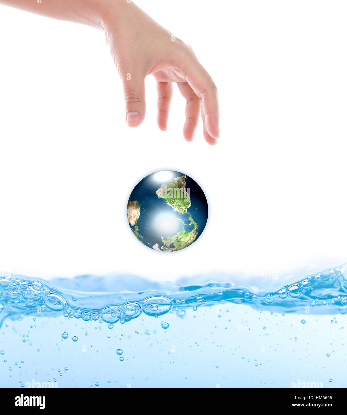 Earth drop from hand over water (Elements of this image furnished by ...
