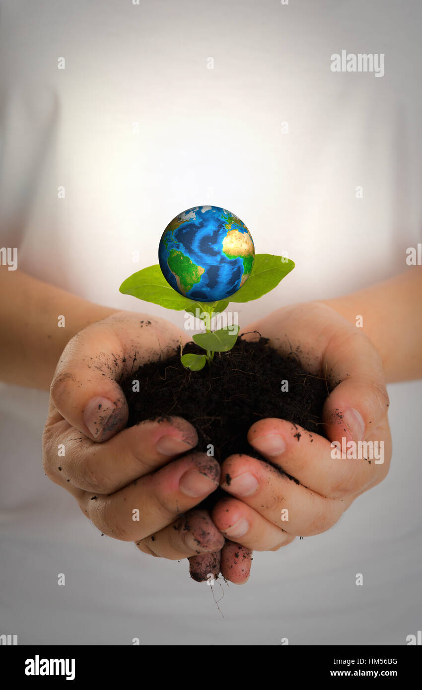 Hands with earth (Elements of this image furnished by NASA Stock Photo ...