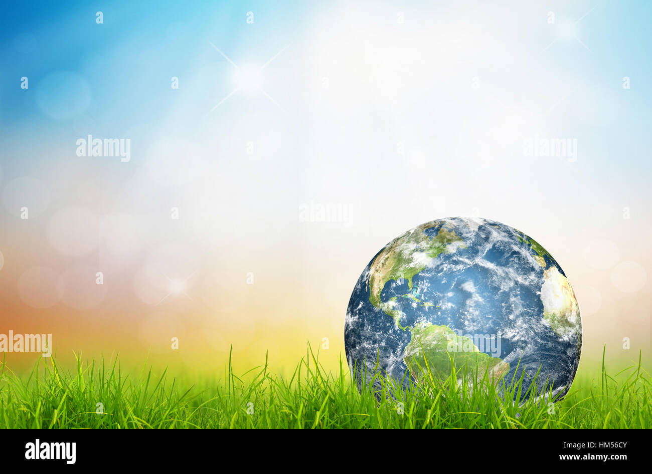 Earth in Fresh spring green grass (Elements of this image furnished by ...