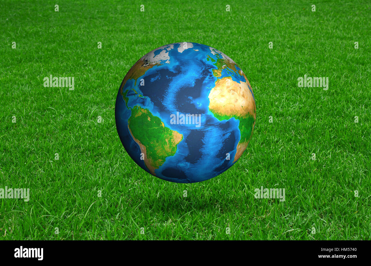 Earth in Fresh spring green grass (Elements of this image furnished by ...