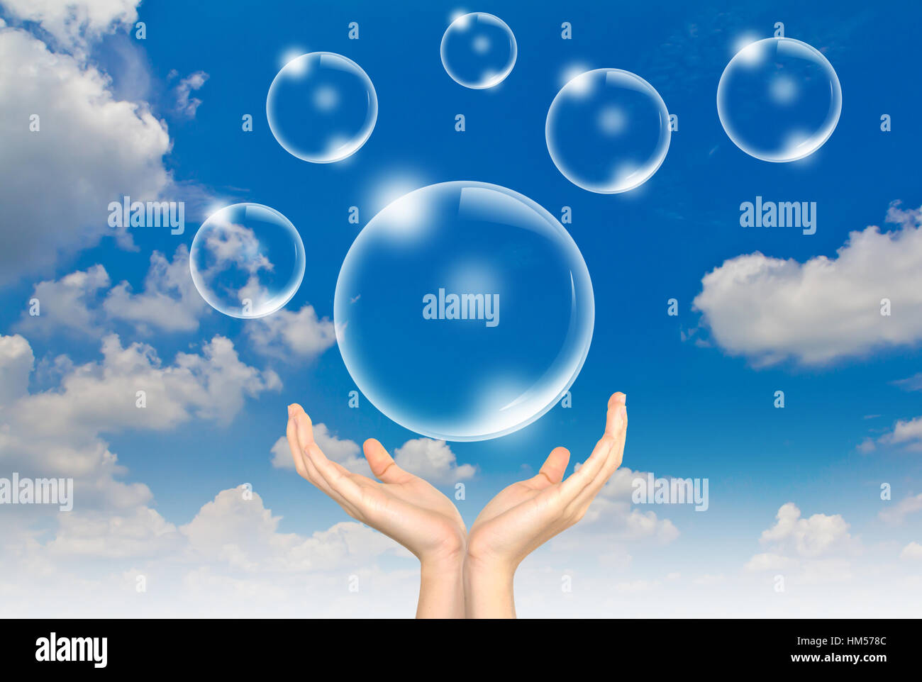 Hand hold Bubbles in the sky with car inside Stock Photo - Alamy