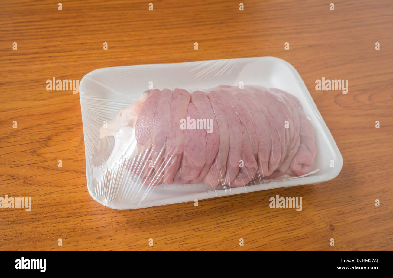 Fresh chitterlings on wood table Stock Photo - Alamy
