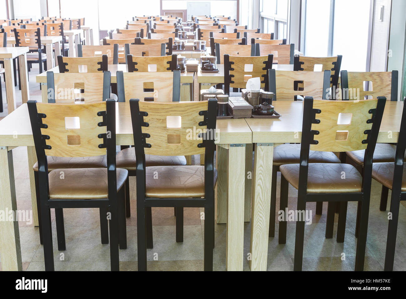 Restaurant interior with wooden table and chair Stock Photo - Alamy