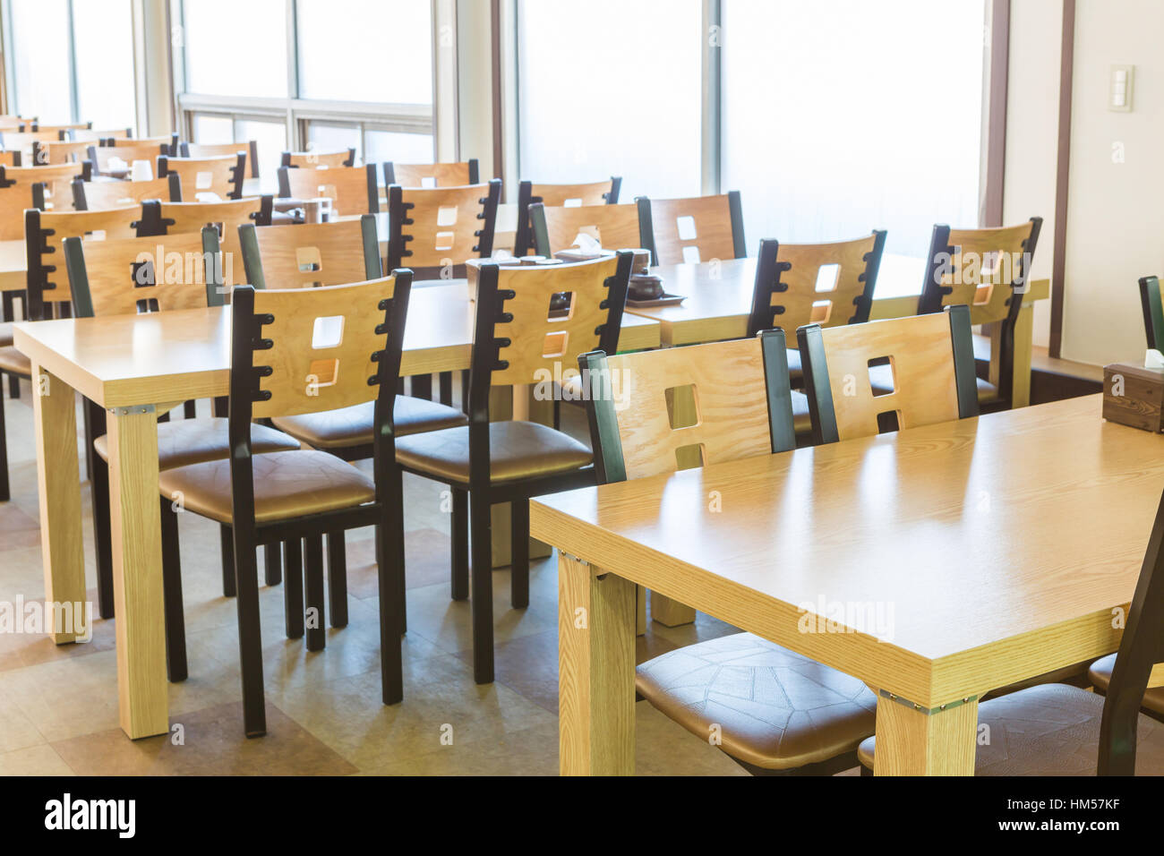 Restaurant interior with wooden table and chair Stock Photo - Alamy