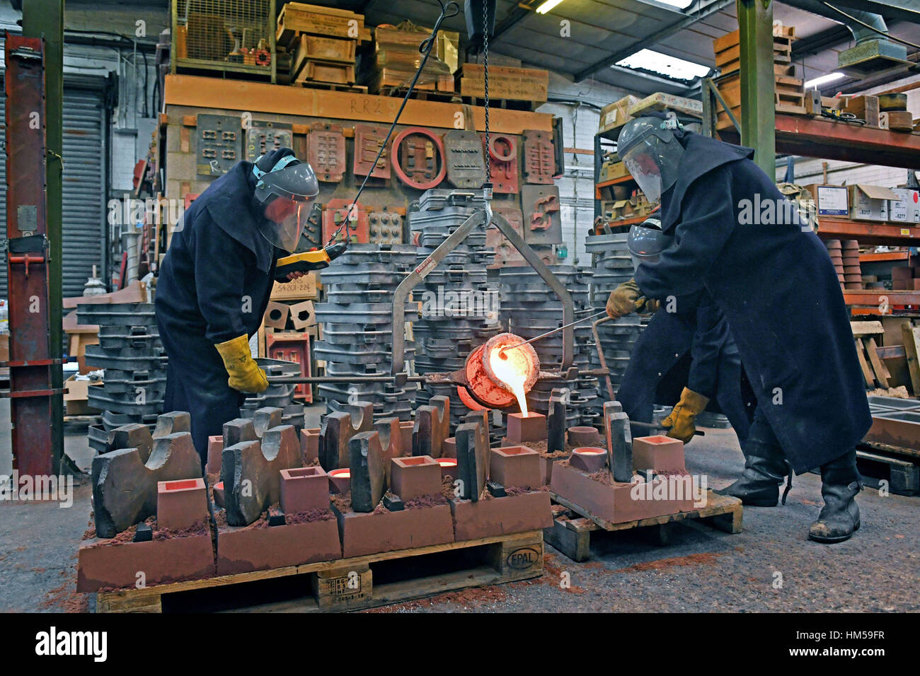 Hot metal is poured into sand casts to make the BAFTA masks at New Pro ...