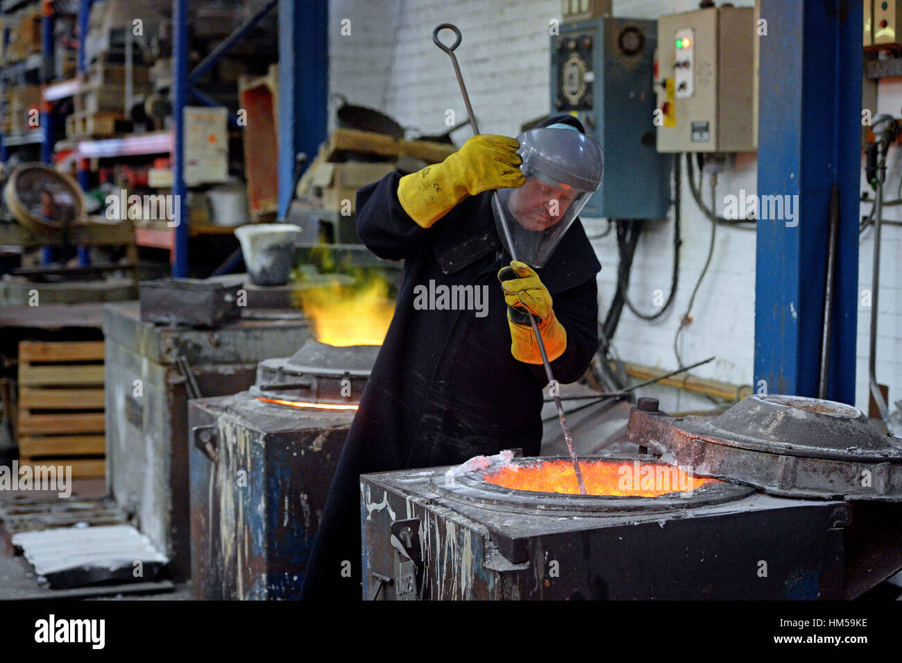 Metal is heated to pour into sand casts to make BAFTA masks at New Pro ...