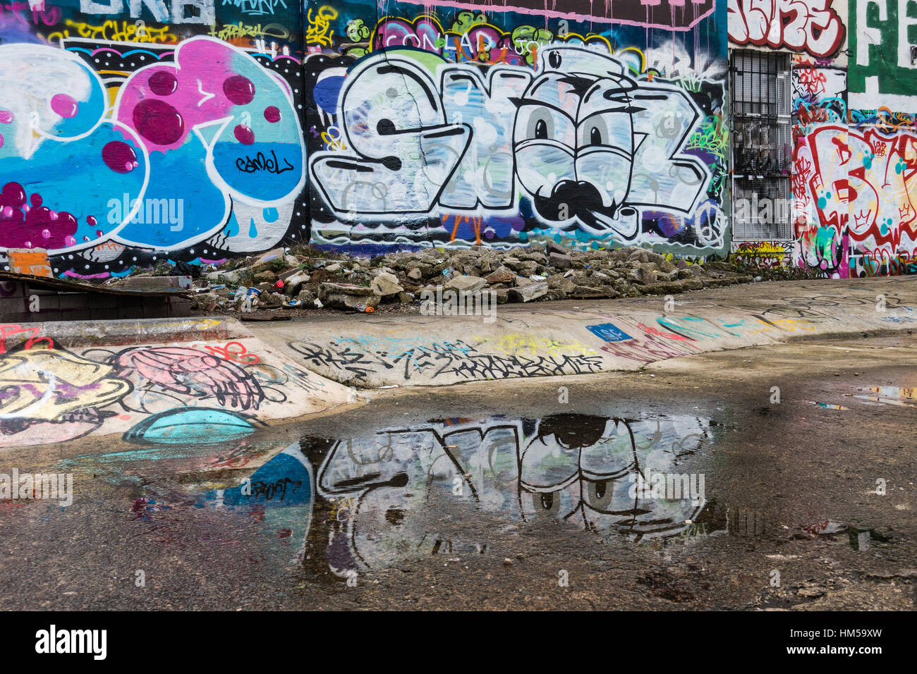Street Art reflected in a puddle in the Baltic Triangle, Liverpool ...
