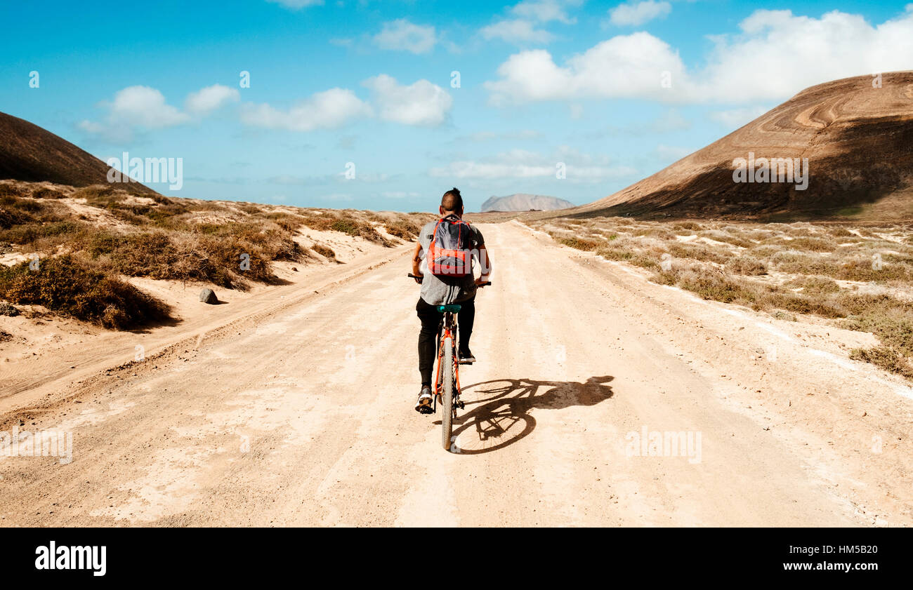 Man seen riding bicycle hi-res stock photography and images - Alamy