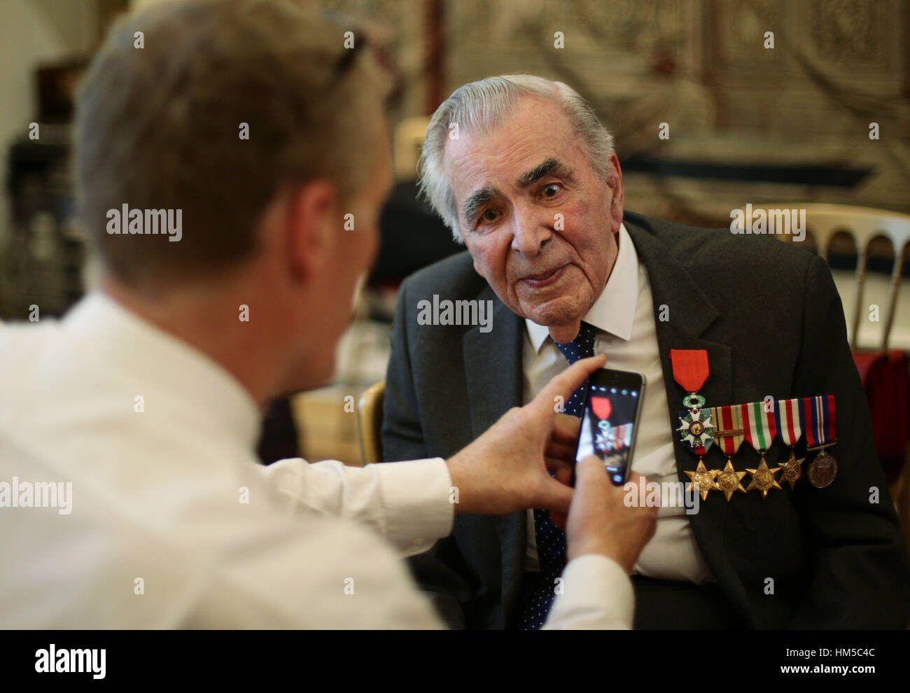 A cameraman takes a photos of Oliver Lucas-Hodge, 93, from Bedfordshire ...