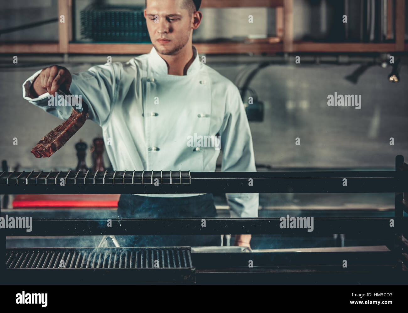 Busy chef at work in the restaurant kitchen Stock Photo - Alamy