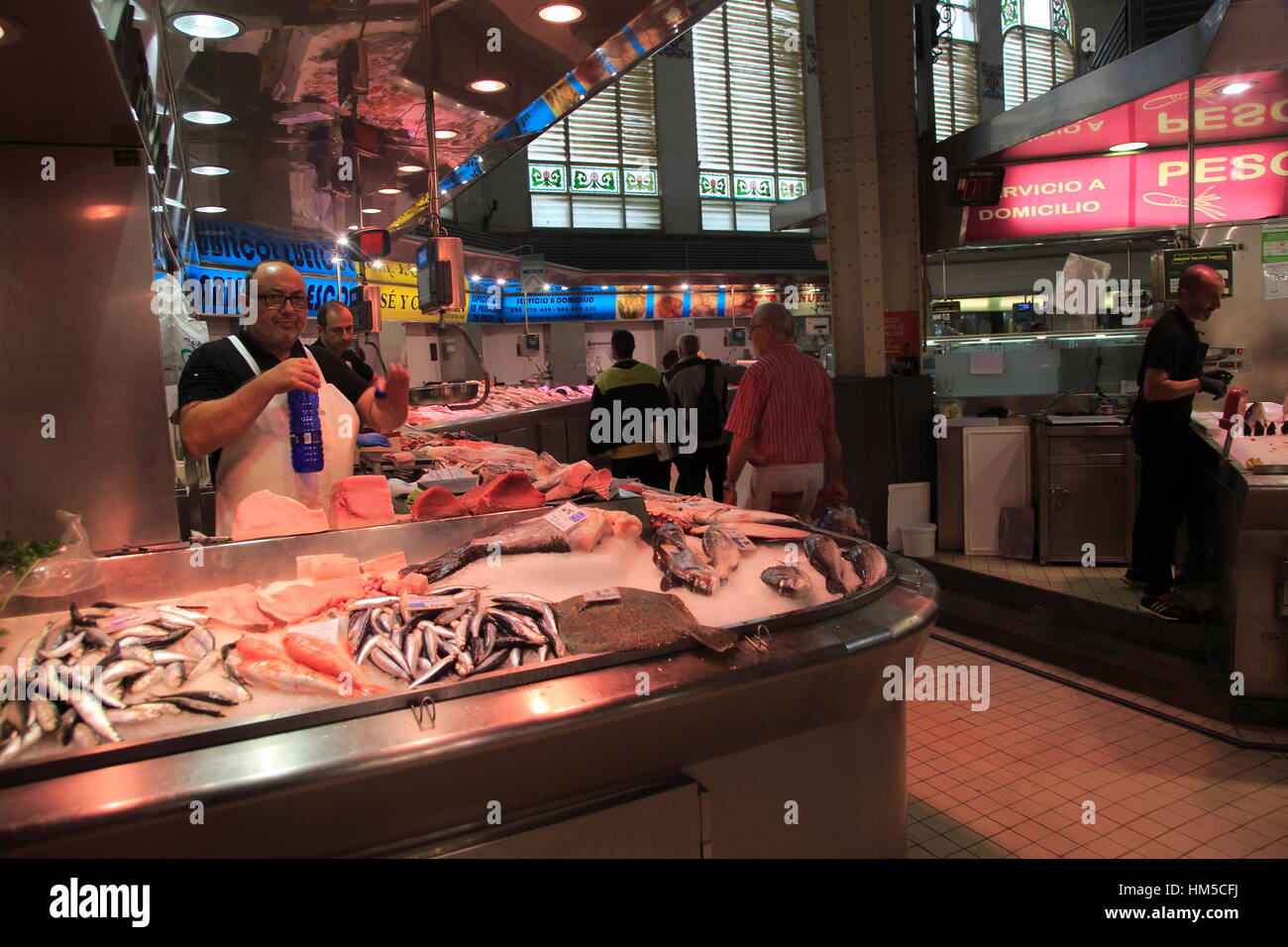 Food stall fishmonger selling fish inside central market building, city ...