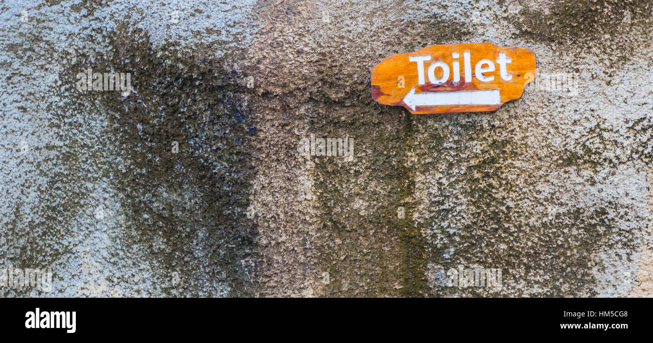 Wooden sign hung over the entrance to a toilet Stock Photo - Alamy