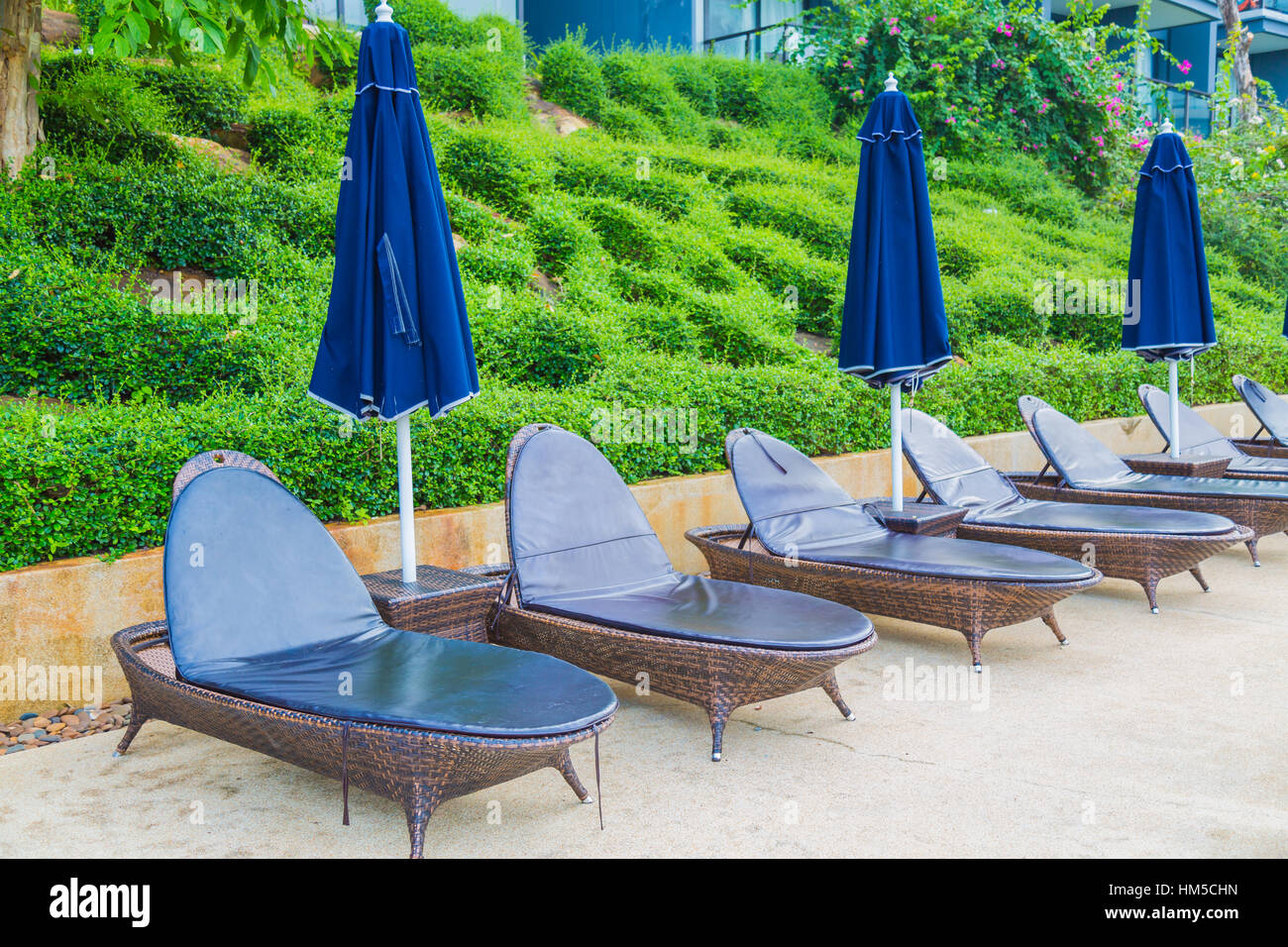 Swimming pool with relaxing seats Stock Photo - Alamy