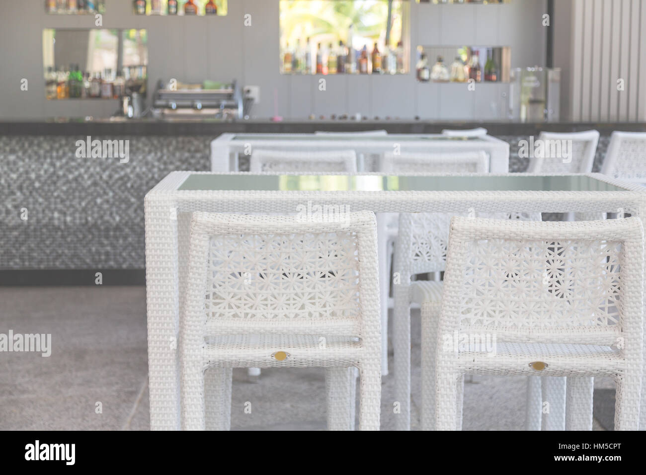 White tables and chairs in restaurant Stock Photo - Alamy
