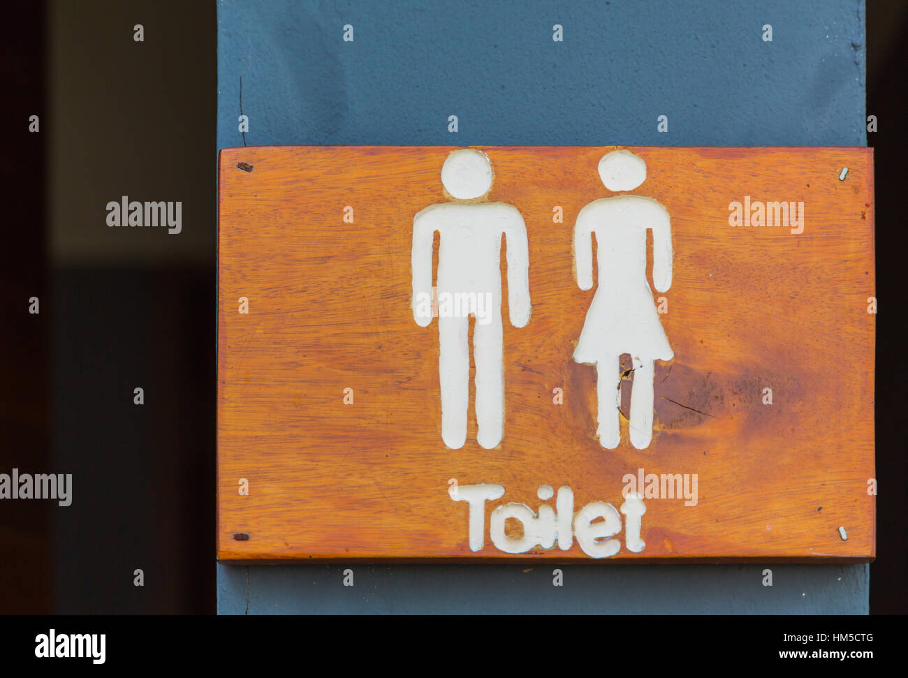 Wooden sign hung over the entrance to a toilet Stock Photo - Alamy