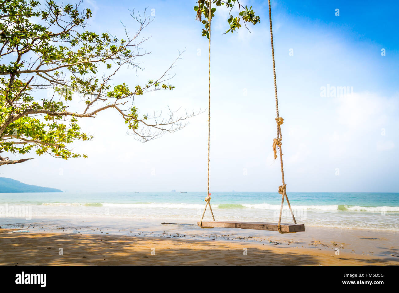 A swing on the beach Stock Photo - Alamy