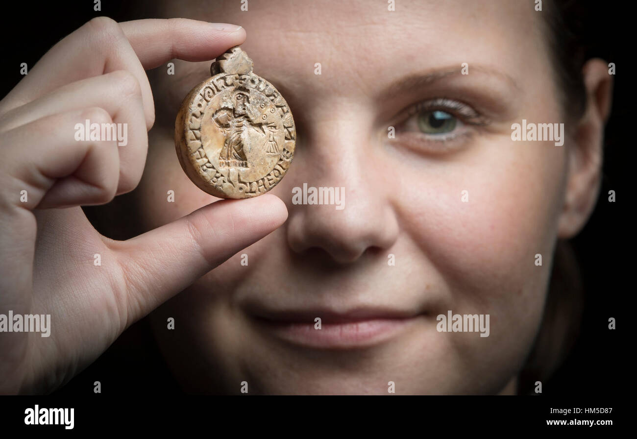 PA BEST Museum employee Lauren Masterman holds The Seal of Snarrus, a ...