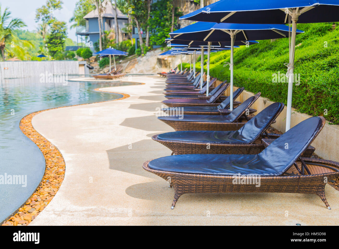 Swimming pool with relaxing seats Stock Photo - Alamy