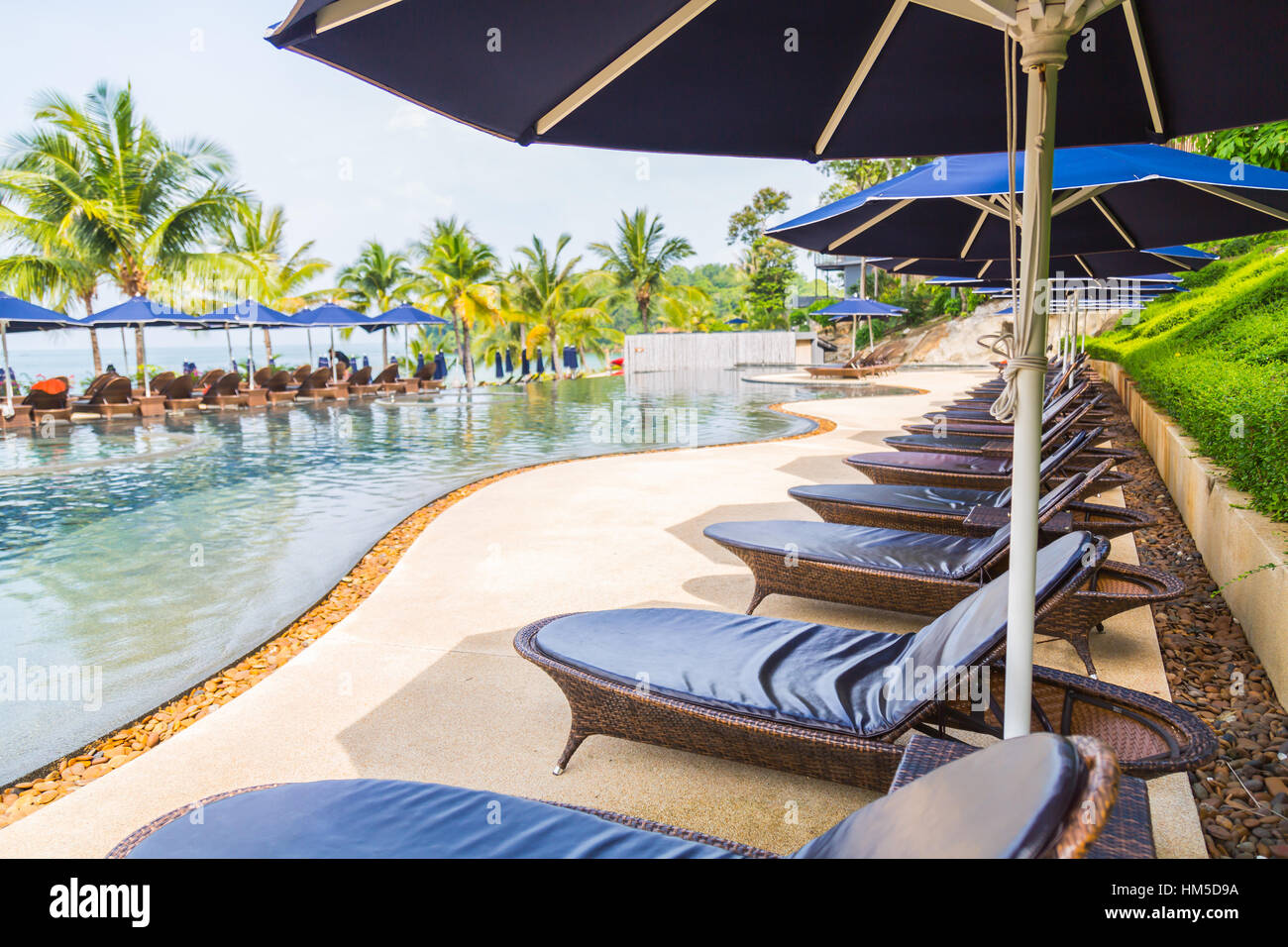 Swimming pool with relaxing seats Stock Photo - Alamy