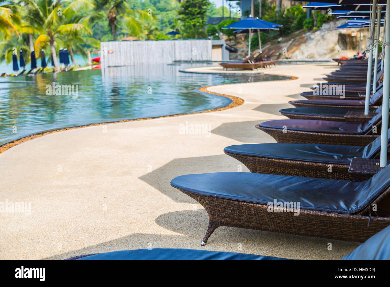Swimming pool with relaxing seats Stock Photo - Alamy