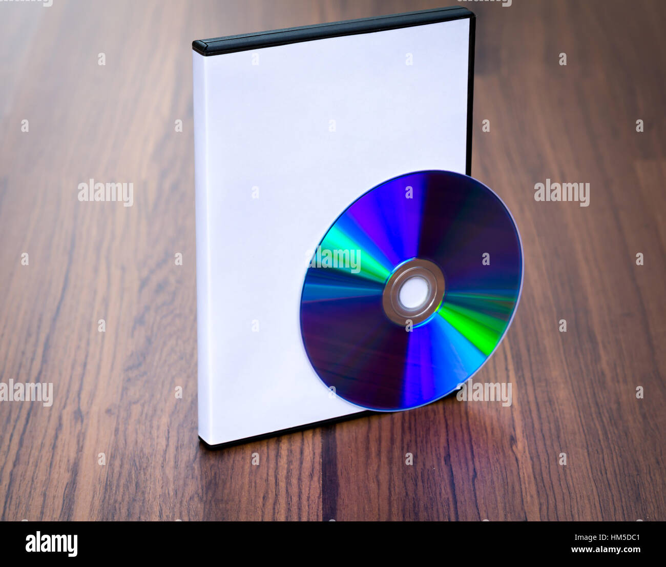 Blank compact disc with cover on wood background ground Stock Photo - Alamy