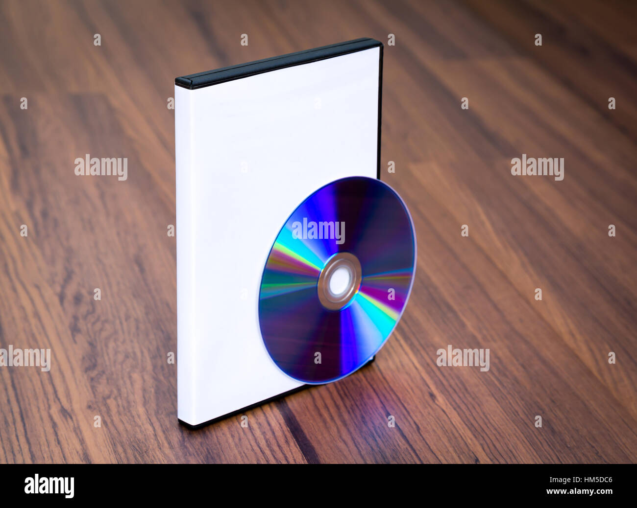 Blank compact disc with cover on wood background ground Stock Photo - Alamy