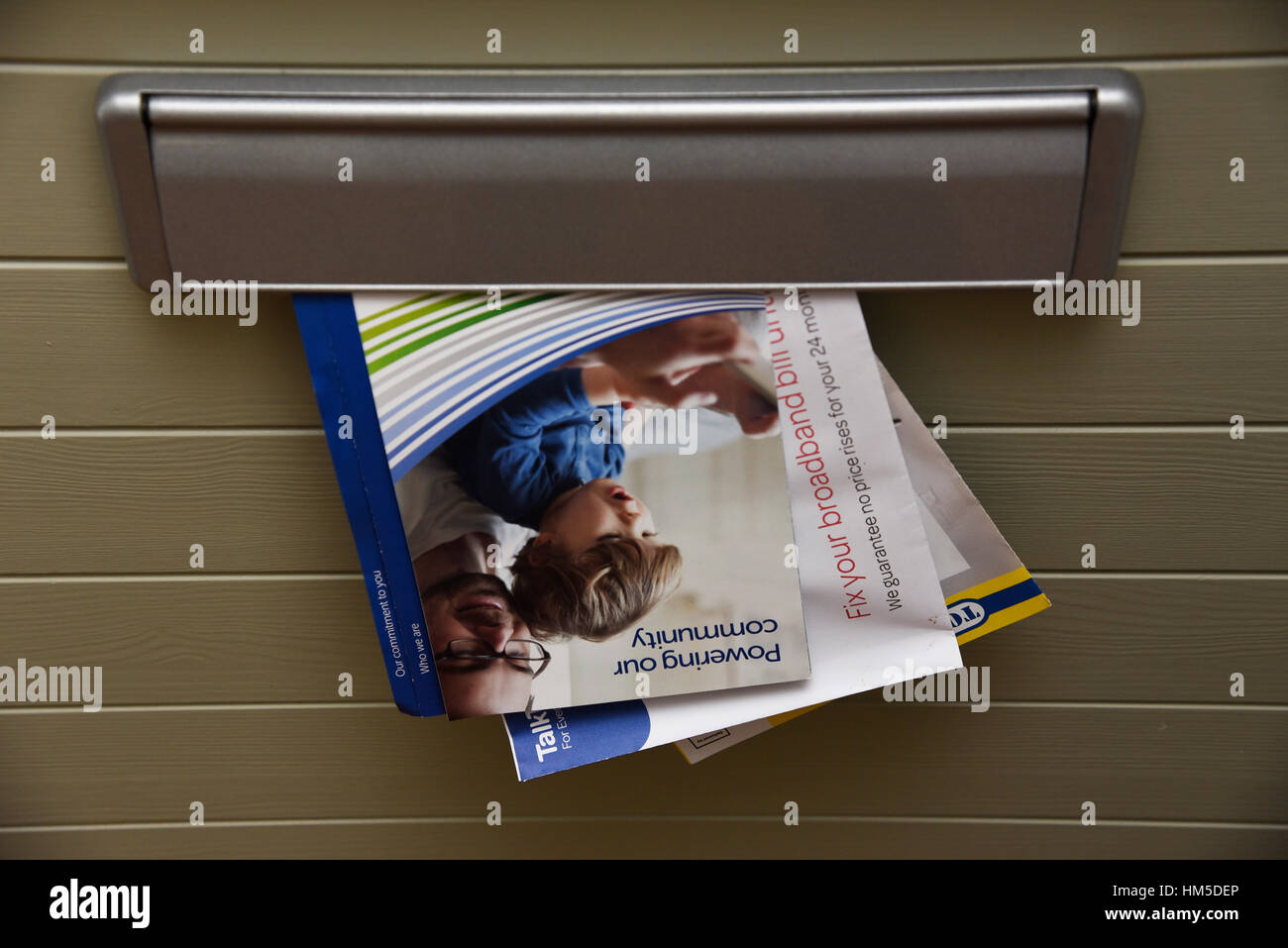 Jump mail posted through letterbox Stock Photo - Alamy