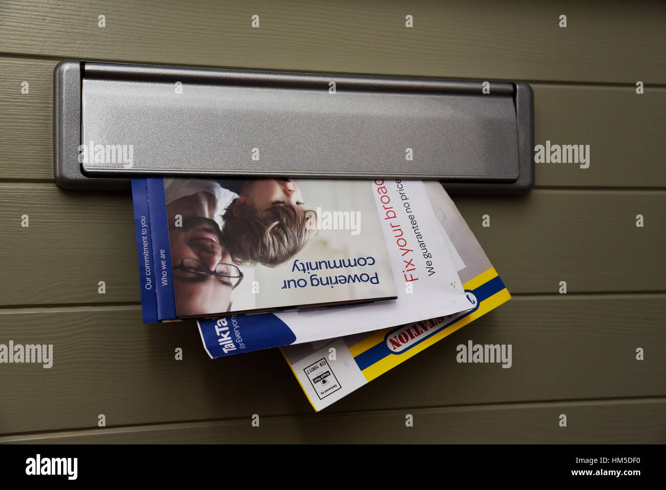 Jump mail posted through letterbox Stock Photo - Alamy