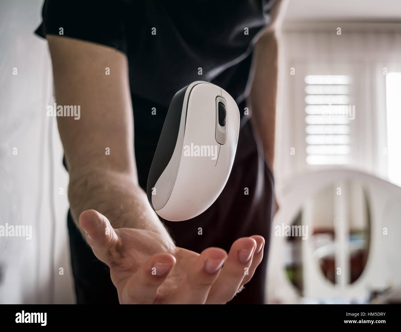 Flying computer mouse (Guy trowing computer mouse in the air Stock ...