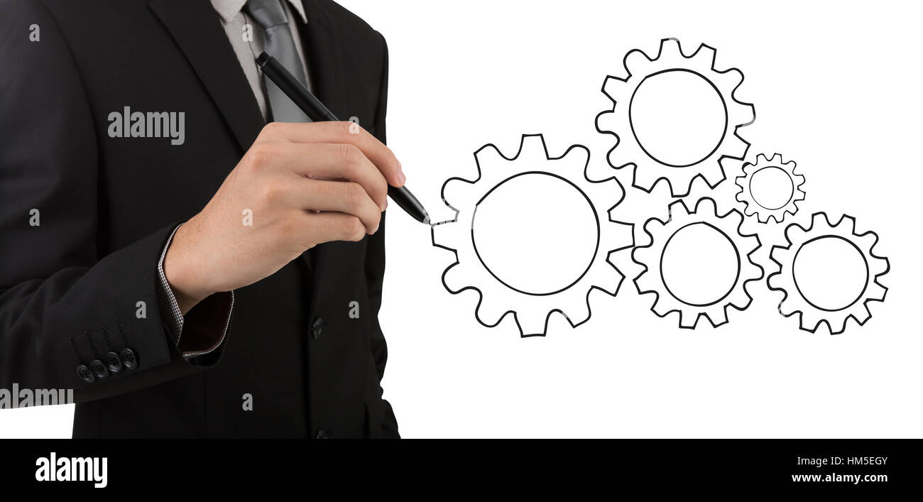 Businessman hand drawing gear to success concept Stock Photo - Alamy