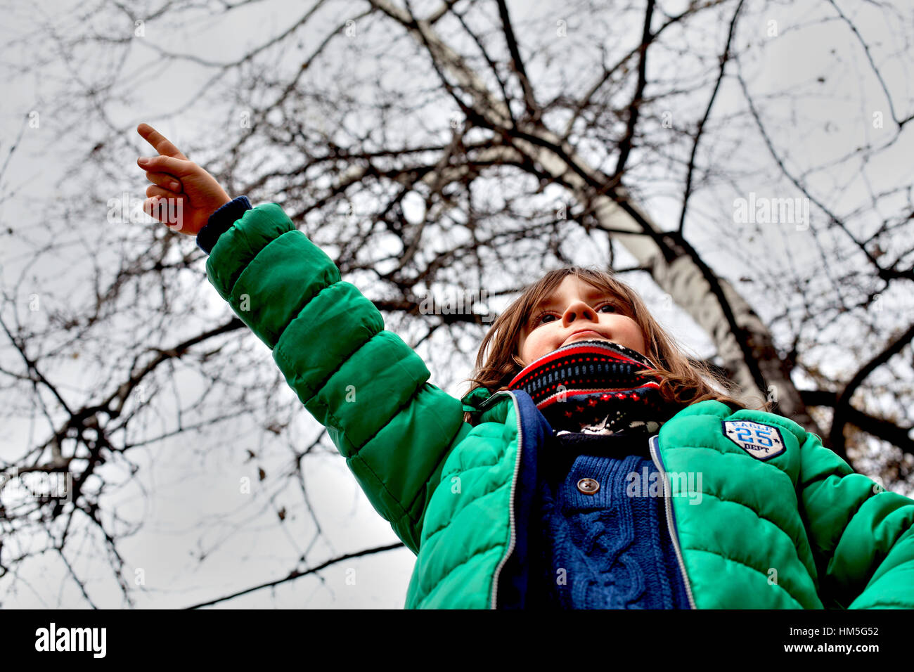Boy pointing towards the sky, Barcelona, Spain Stock Photo - Alamy